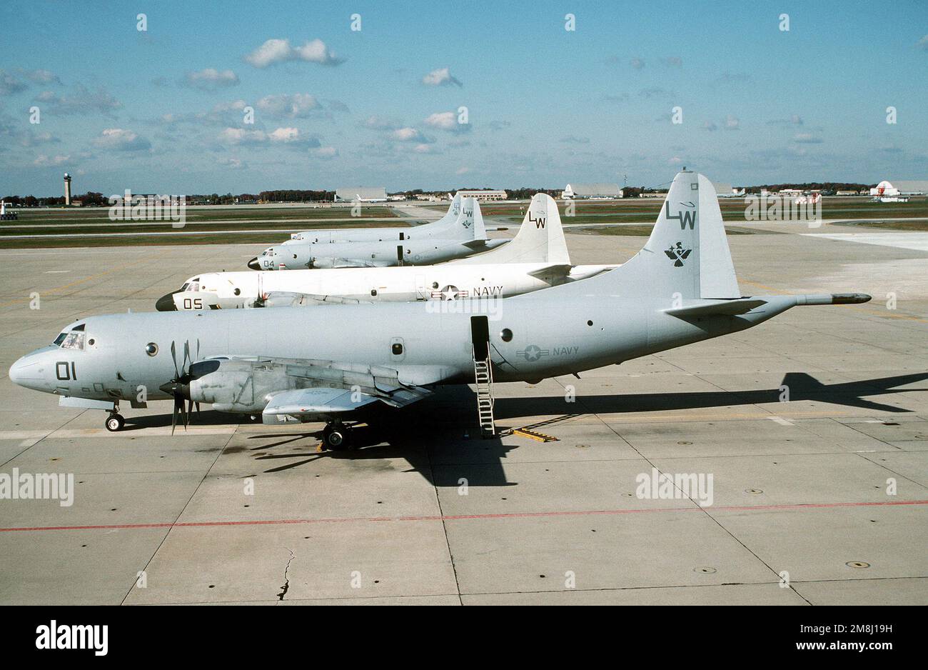 Four P-3C Orion aircraft are parked on the flight line. The rear ...