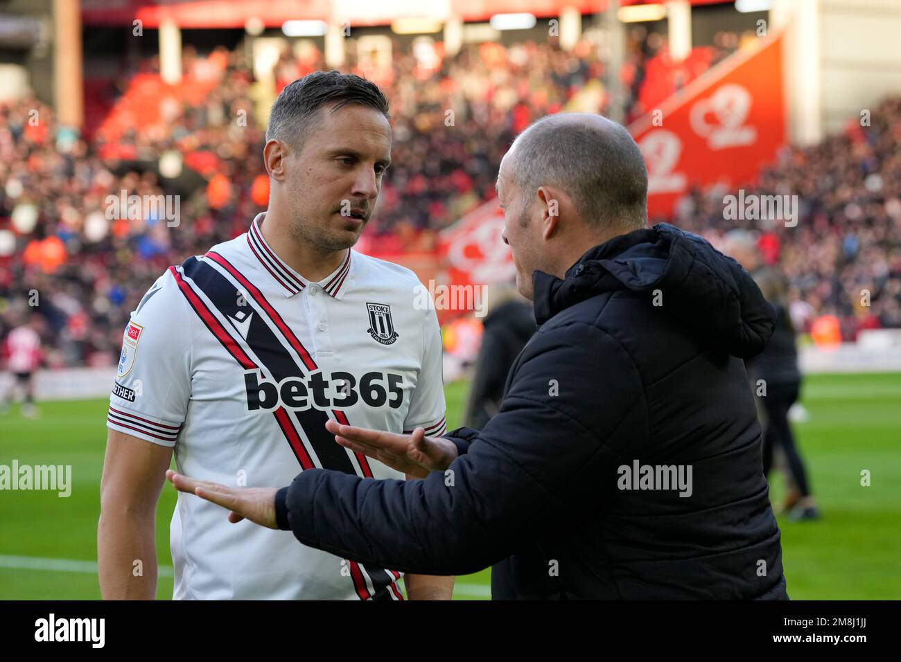 Alex Neil Manager of Stoke City gives instructions to Phil Jagielka #6 ...