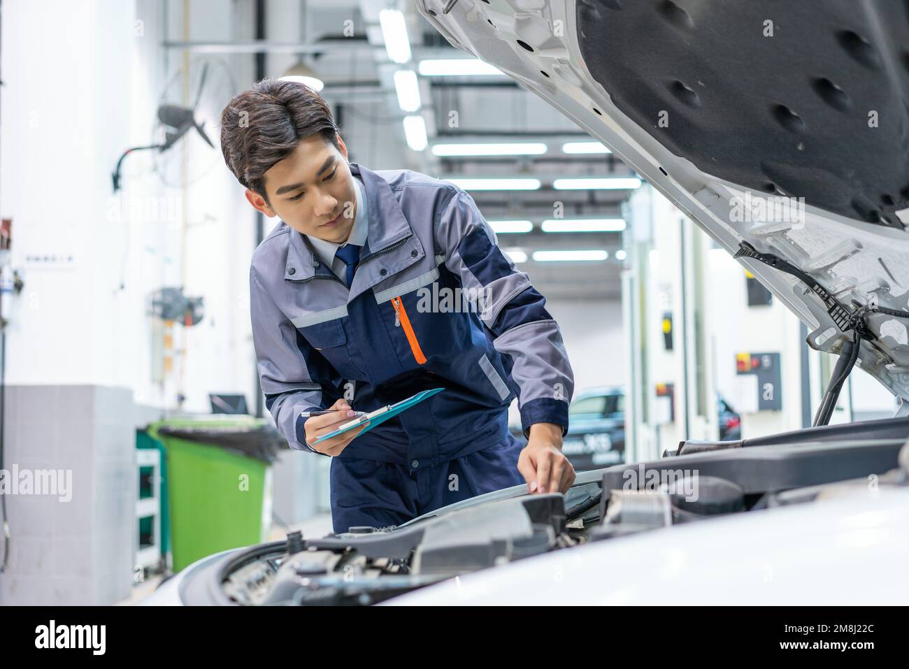 Repair shop mechanics researchers Stock Photo - Alamy
