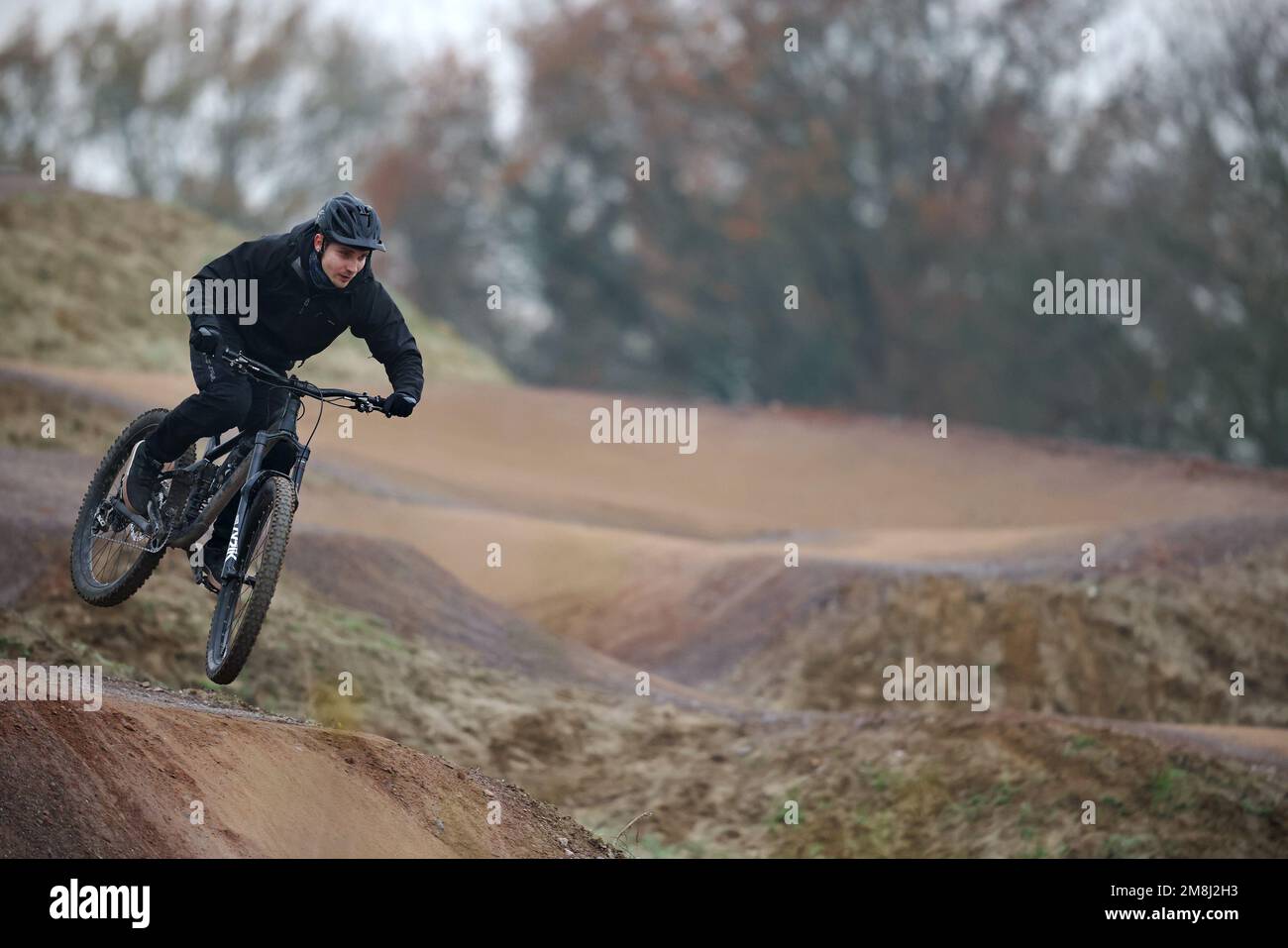 Mountain bike riders in action at a BMX and pump track near Fleet in ...