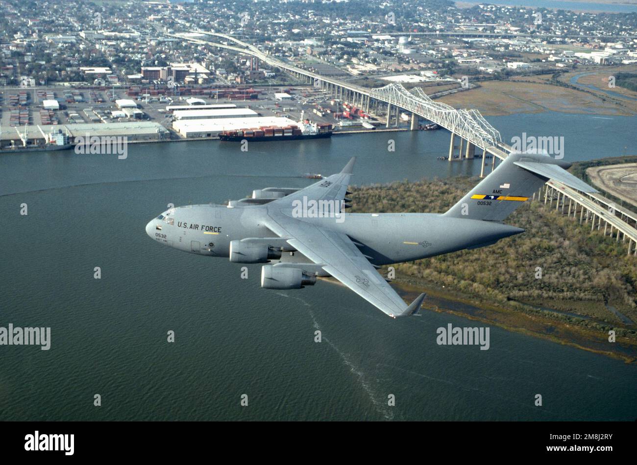 Air to air left side view of an Air Mobility Command's 437th Airlift ...