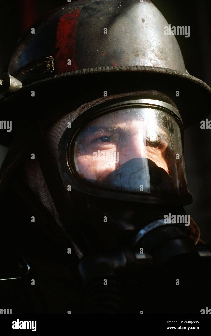 An advanced shipboard fire fighting student wearing an A-4 oxygen ...