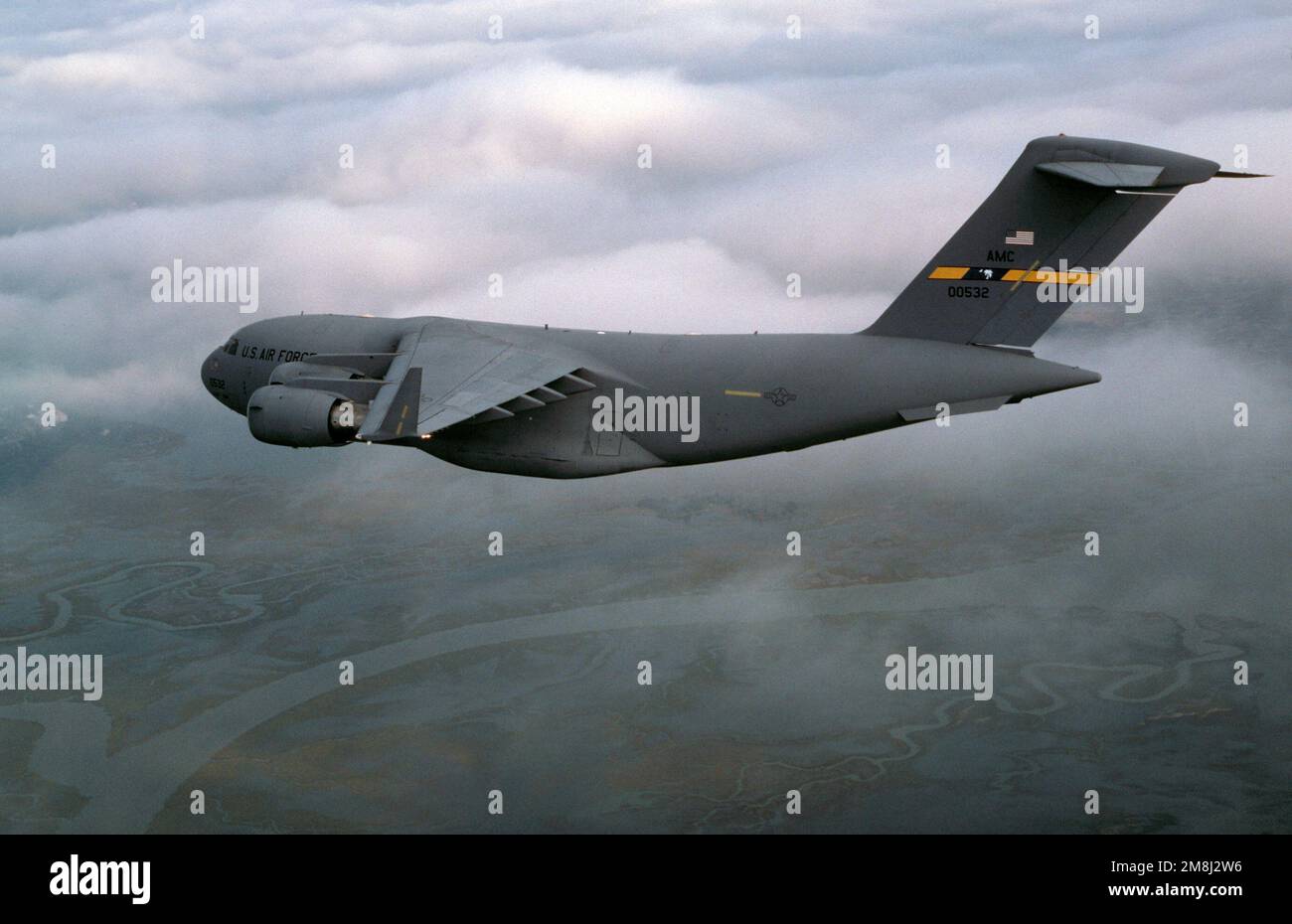 Air to air left side view of an Air Mobility Command's 437th Airlift ...