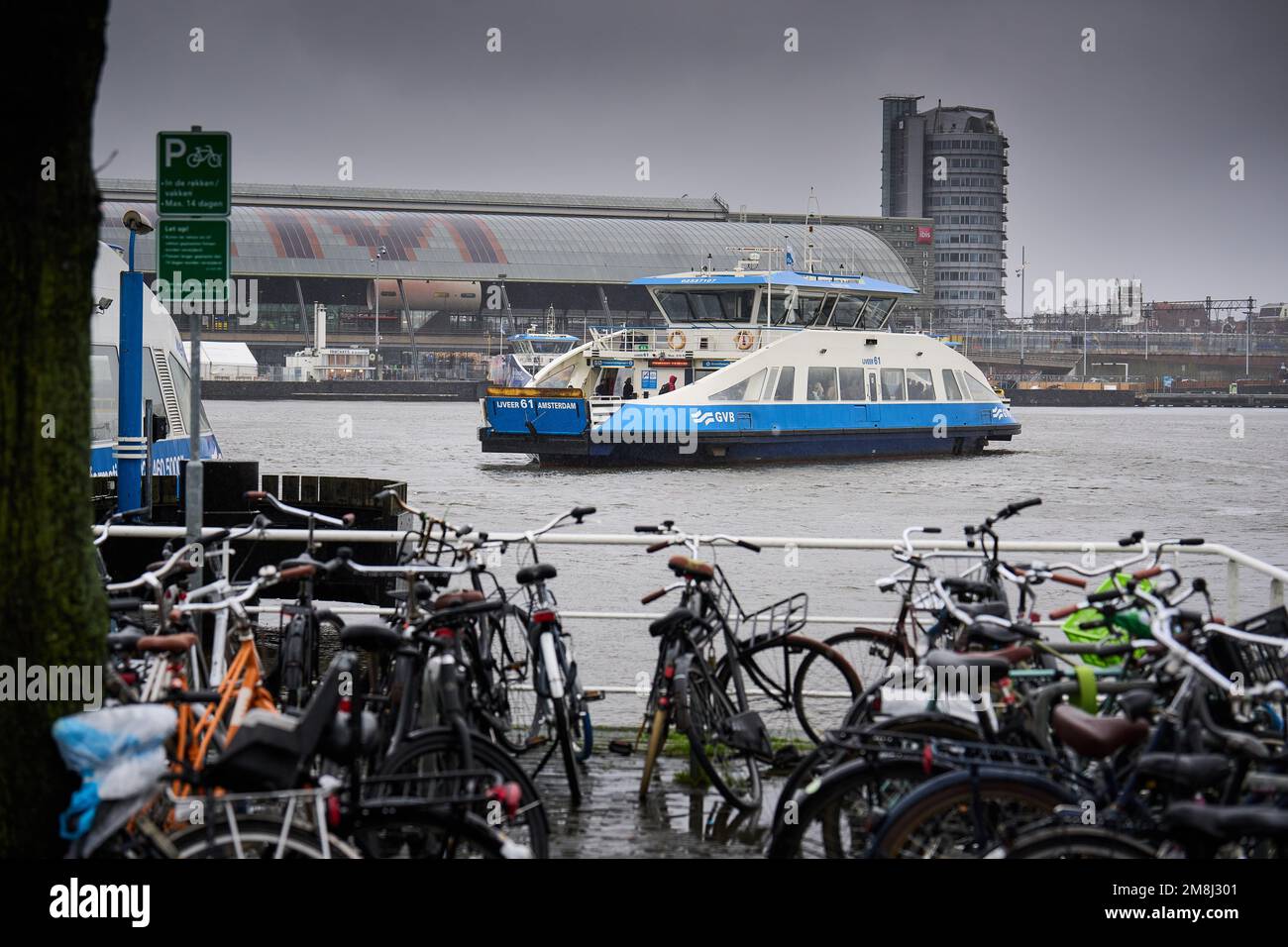 AMSTERDAM - Travelers on the ferry point between Amsterdam-Noord and ...