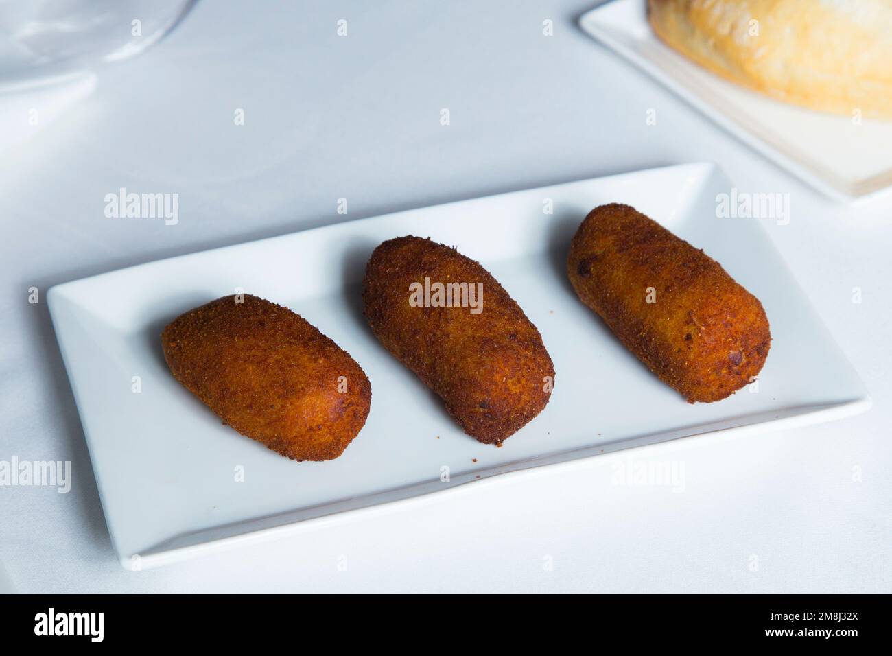Spanish croquettes. The croquette is a portion of dough made from a ...