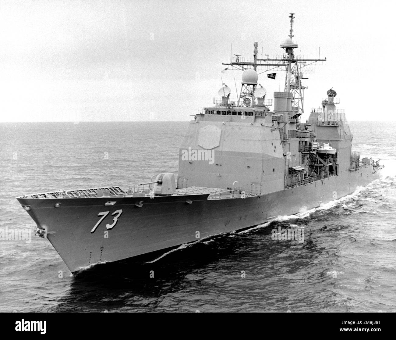 A low oblique port bow on view of the guided missile cruiser USS PORT ...
