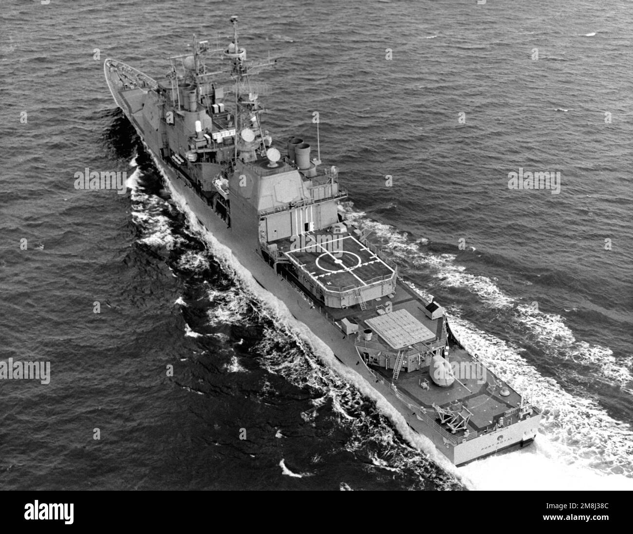 A high oblique port quarter view of the guided missile cruiser USS PORT ...