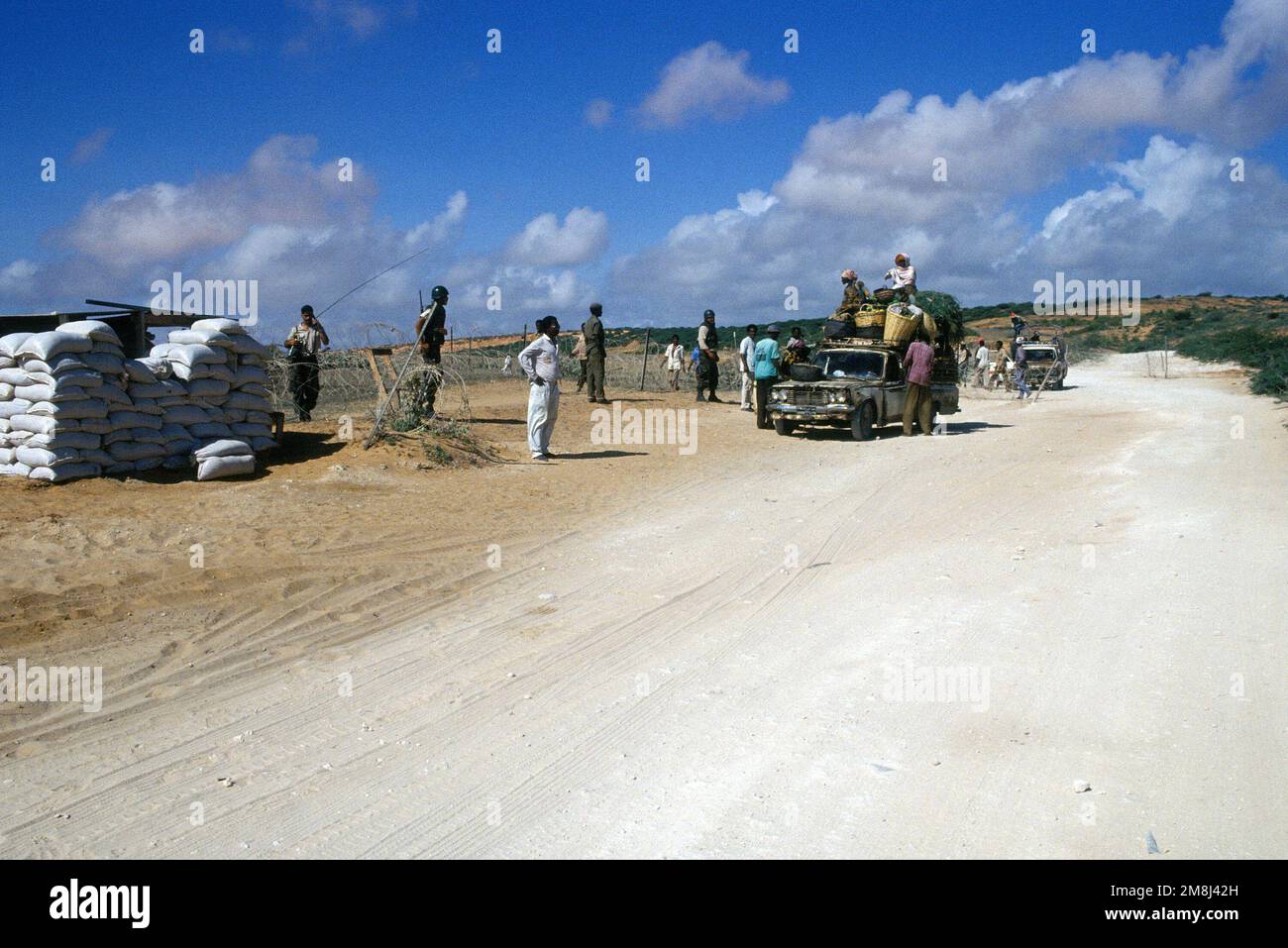 Moroccan soldiers pull a Somali vehicle over at a checkpoint to search ...