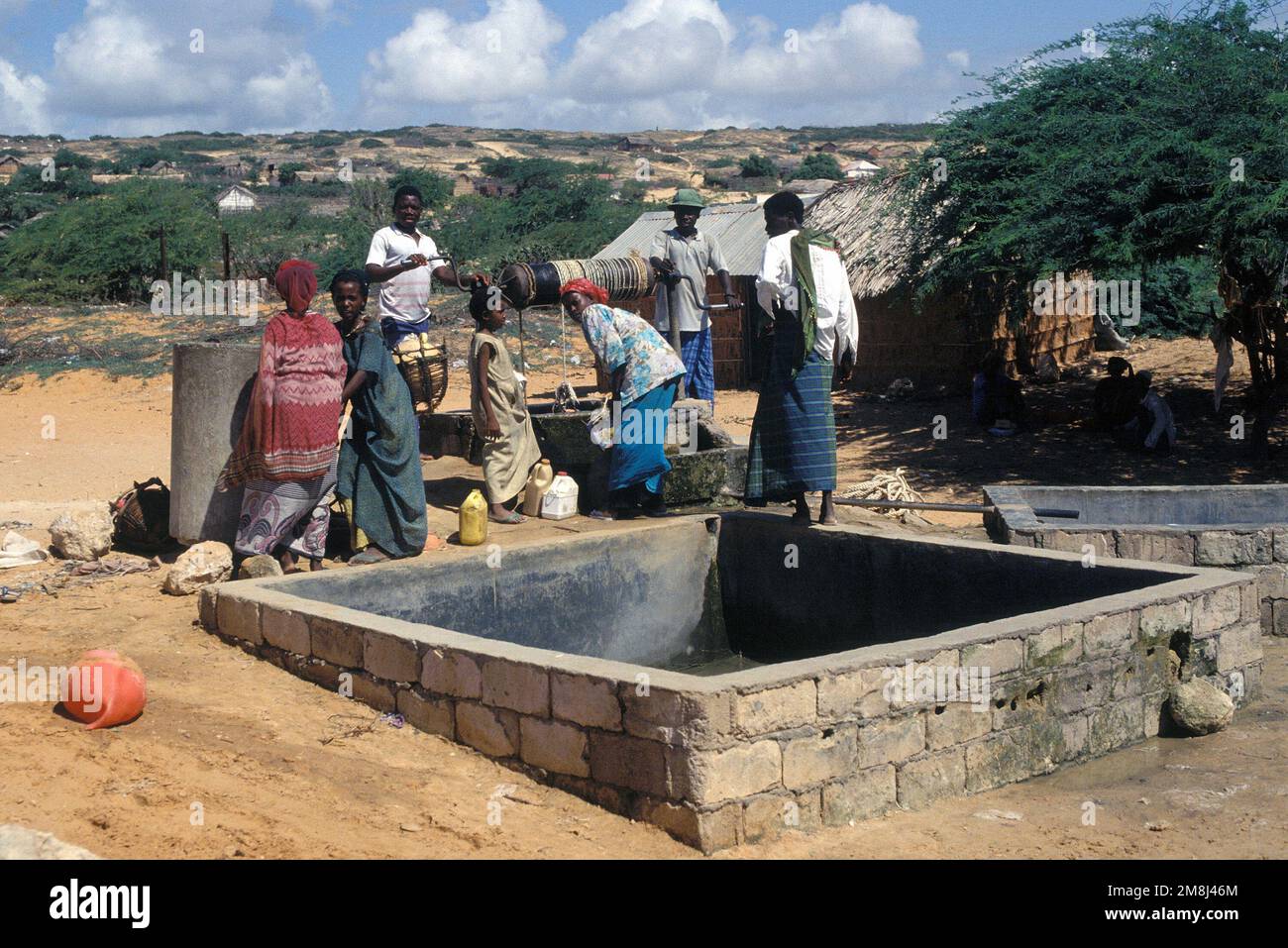 Somalis gather to draw from a well in the village. The Moroccan Army ...