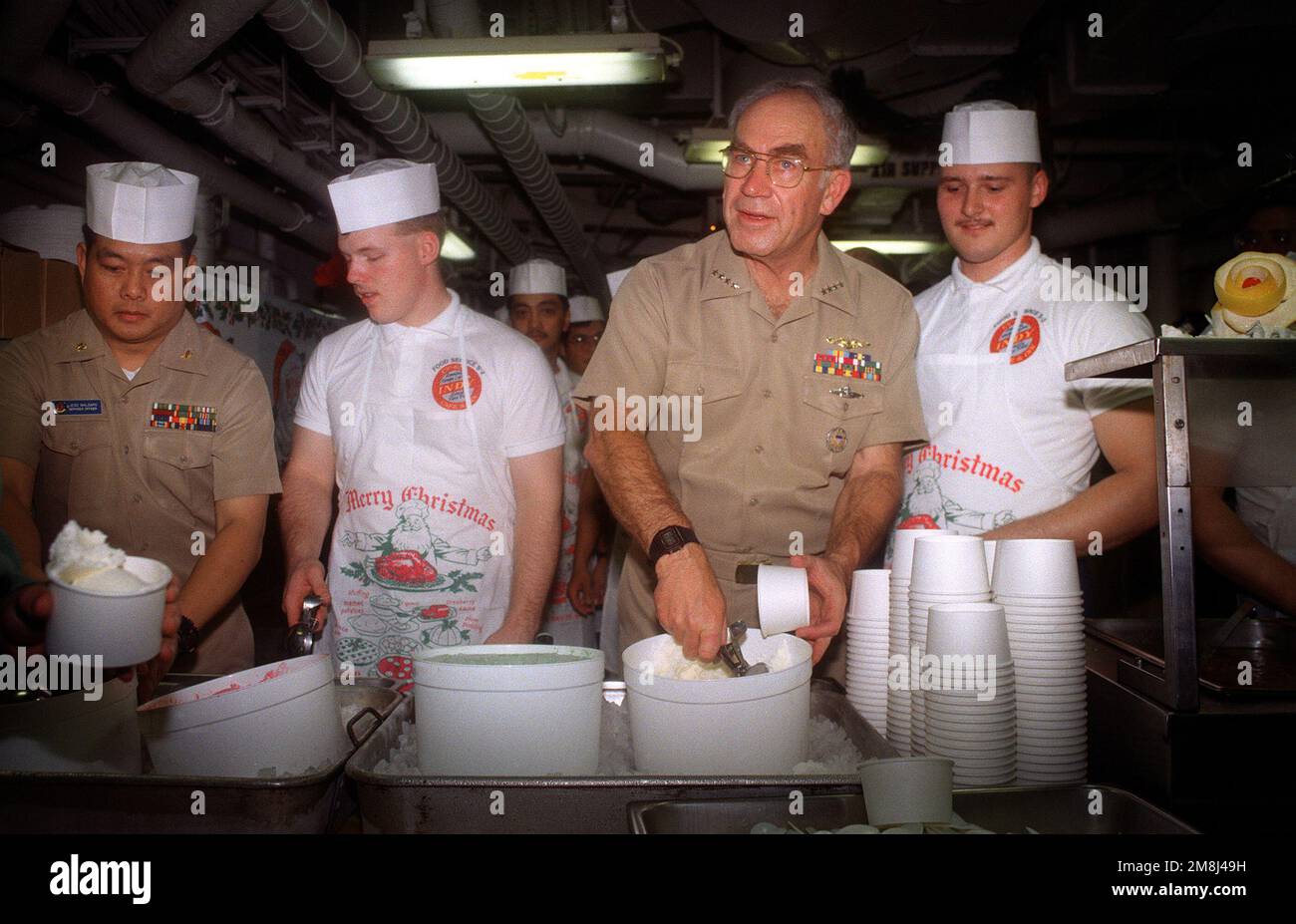 Admiral Frank B. Kelso, II, CHIEF of Naval Operations, assists ...