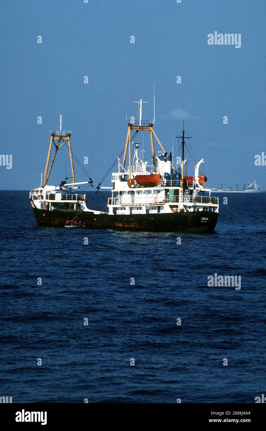 A rigid boat carrying a boarding team from the guided missile frigate ...