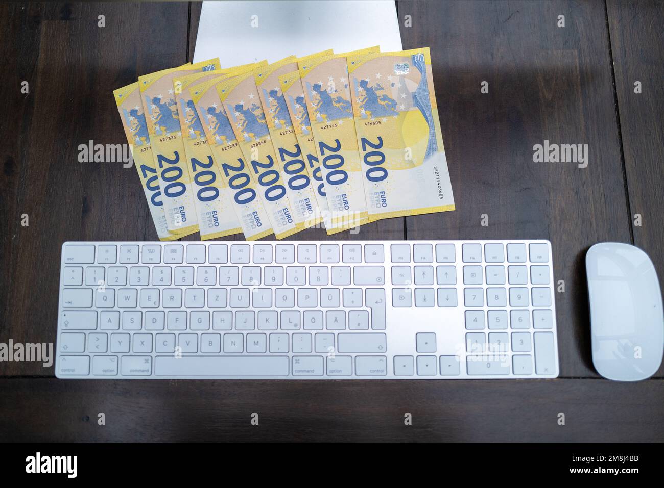 some 200 euro banknotes are lying next to a computer keyboard Stock ...