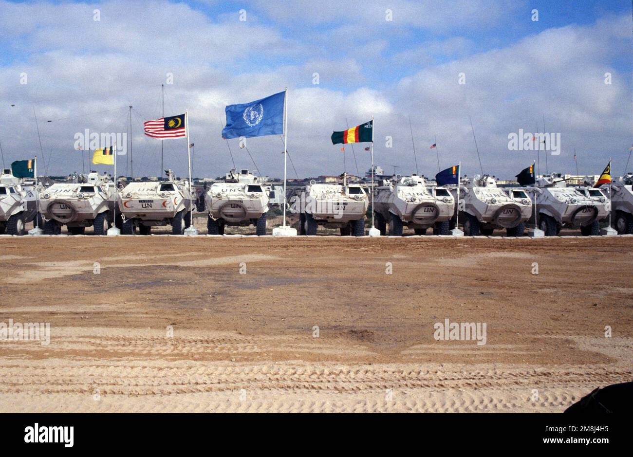 The United Nations and Malaysian national flags stand out amidst the ...