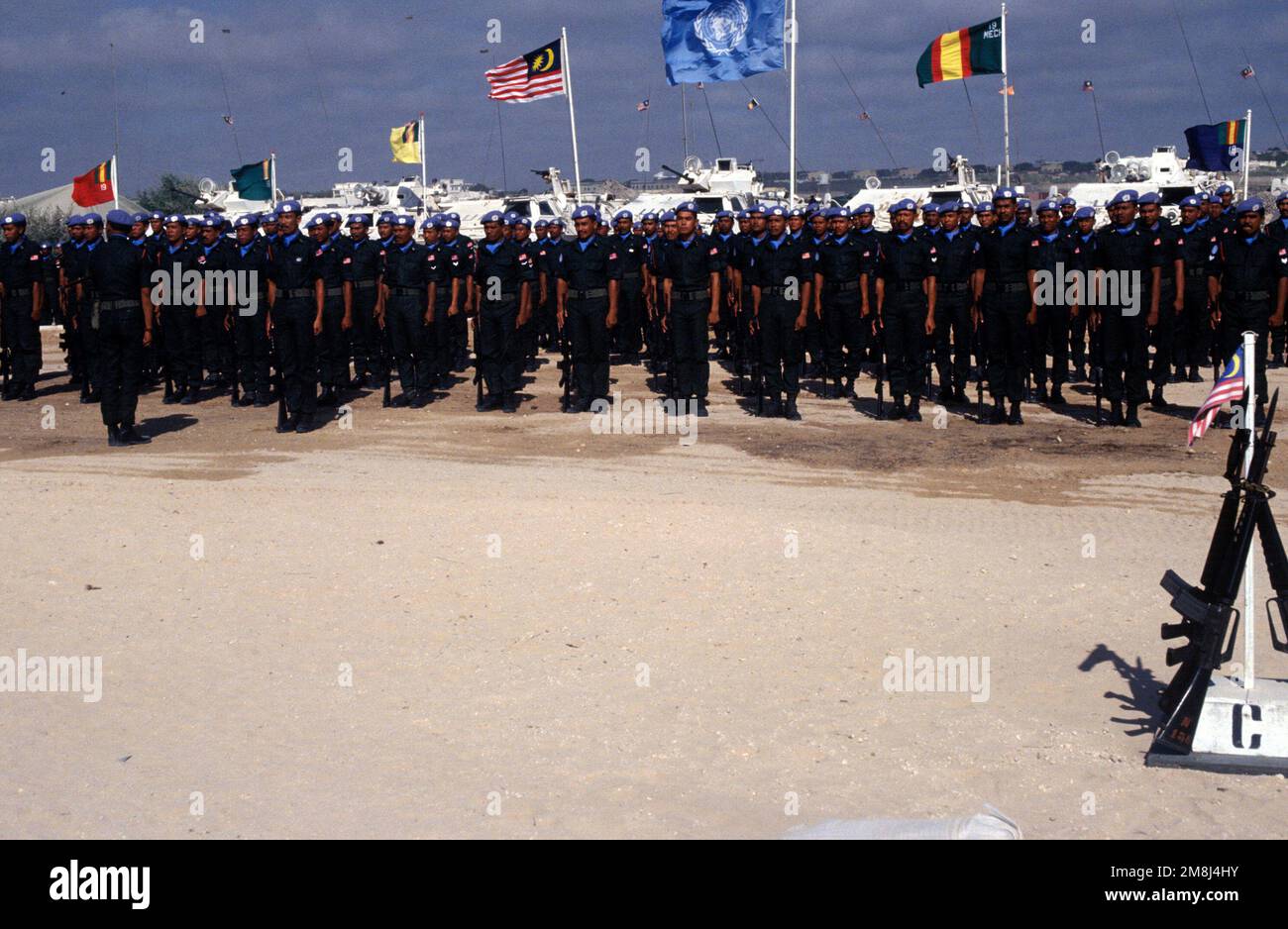 Malaysian Army troops stand at attention during their awards ceremony ...