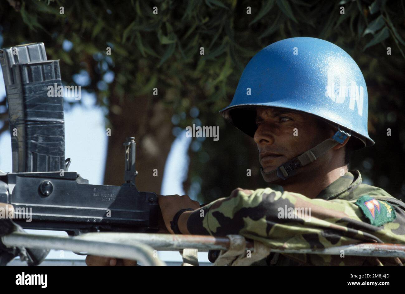 A member of the Nepalese Quick Reactionary Force (QRF) stands ready at ...