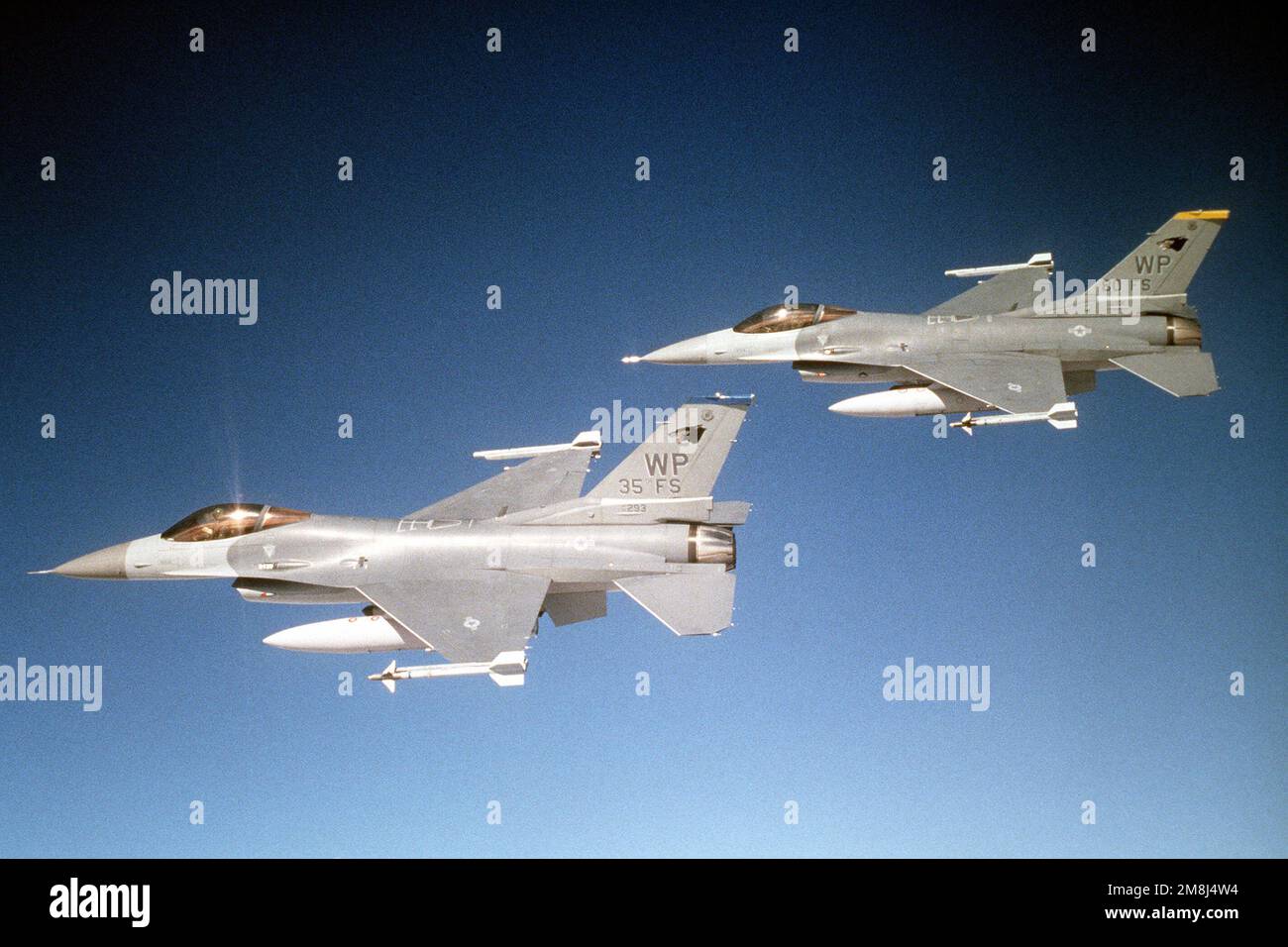 A pair of F-16C "Fighting Falcons" from the 35th and 80th Fighter ...