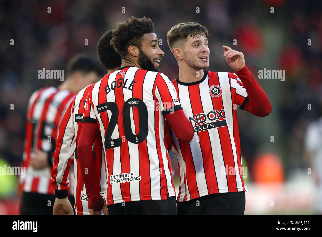 Sheffield United's Jayden Bogle (centre)celebrates with James McAtee ...