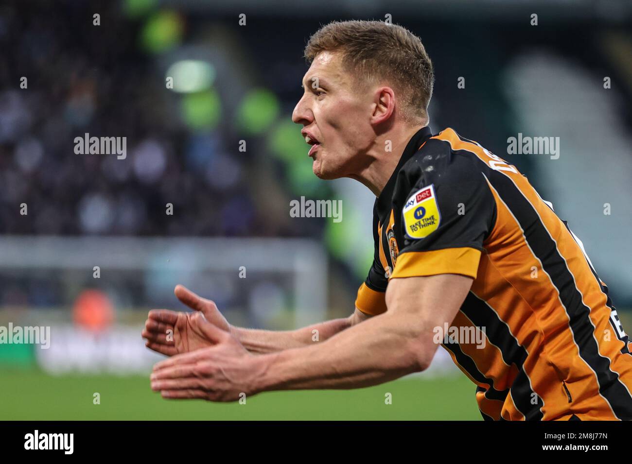 Greg Docherty #8 of Hull City reacts with the line official during the ...
