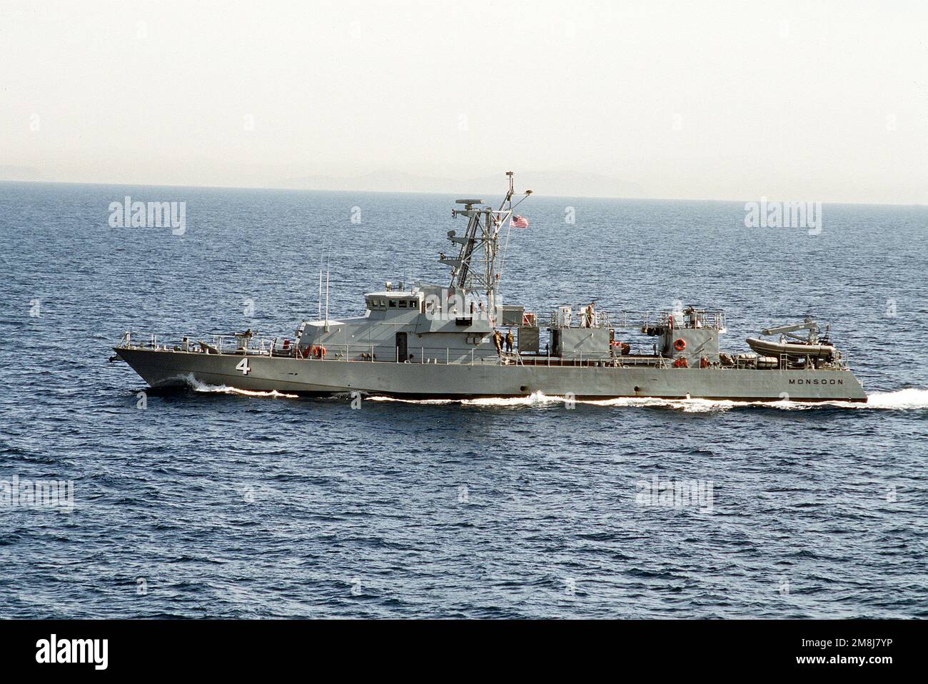Aerial port side view of the patrol craft USS MONSOON (PC-4) underway ...
