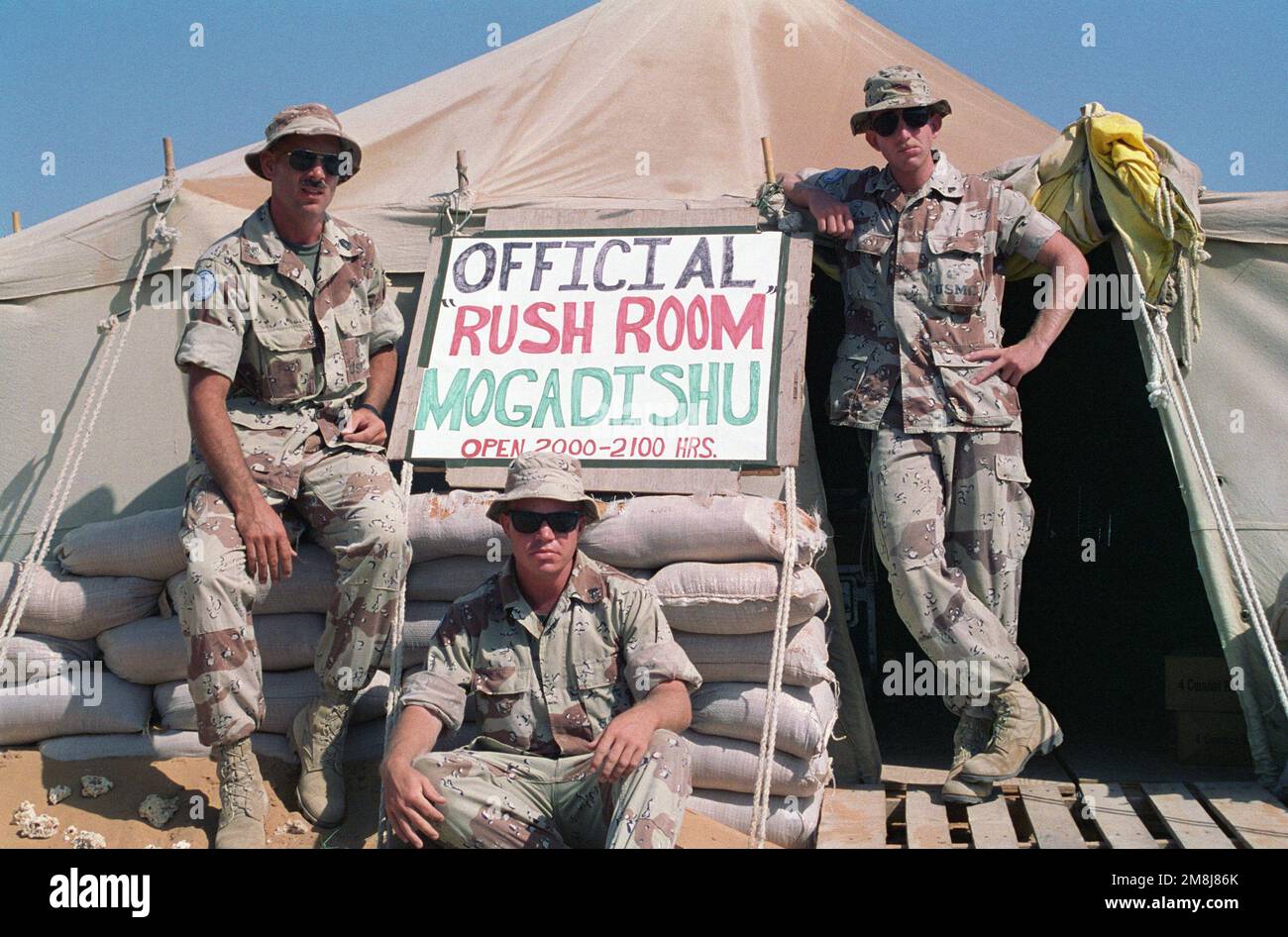 The Joint Combat Camera Team poses for a group picture at the entrance ...