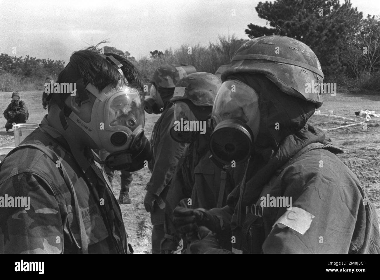 Members of Navy Mobile Construction Battalion Four (NMCB-4) are ...