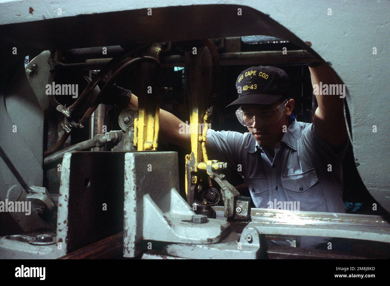 Hull Maintenance Third Class (HT3) Donny Bordwell cuts a one and one ...