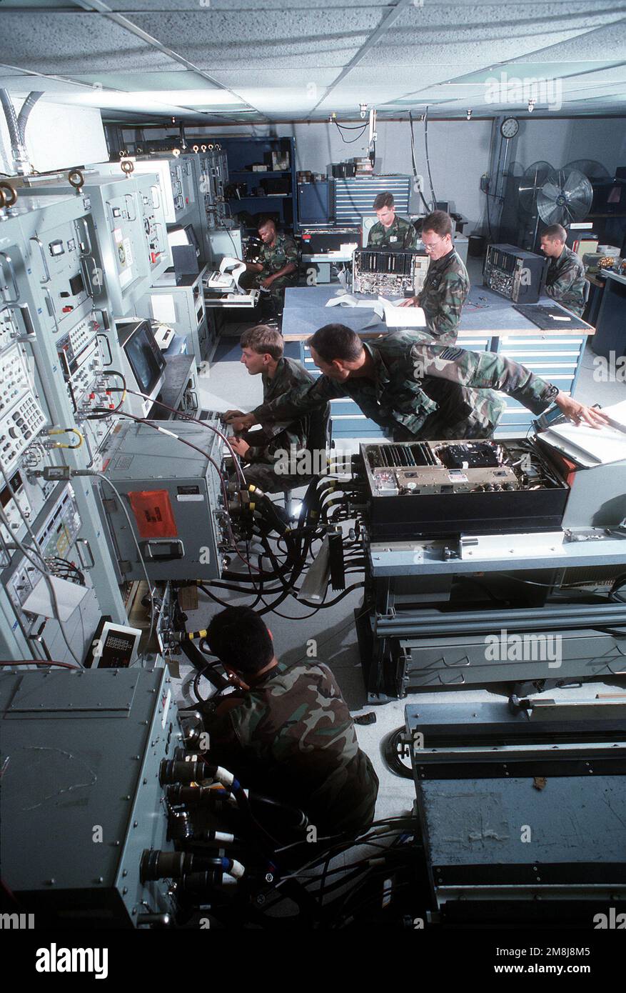 Communications Maintenance personnel at work repairing and testing ...