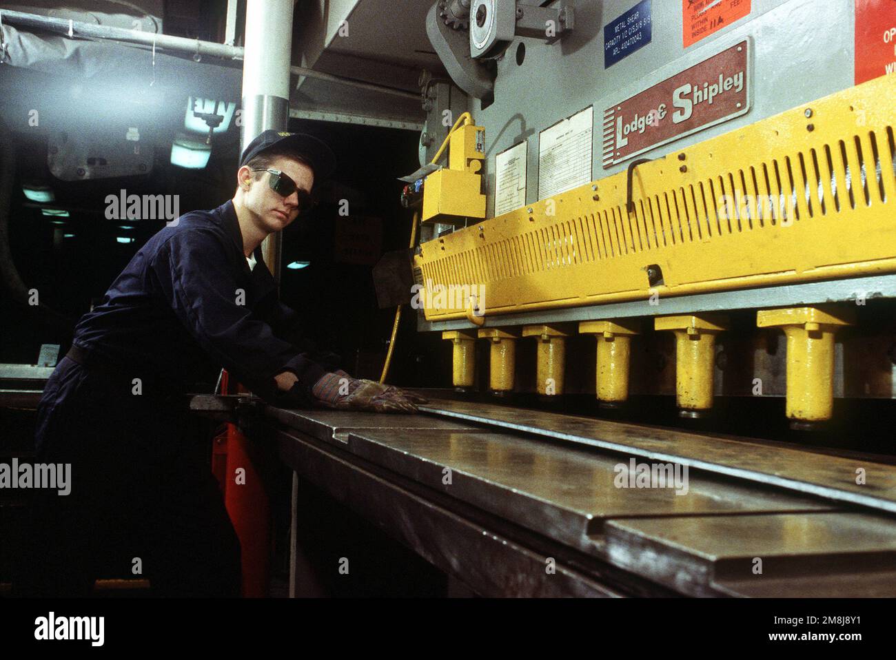 Hull Maintenance Second Class (HT2) Conrad Chenweth cuts a one and one ...