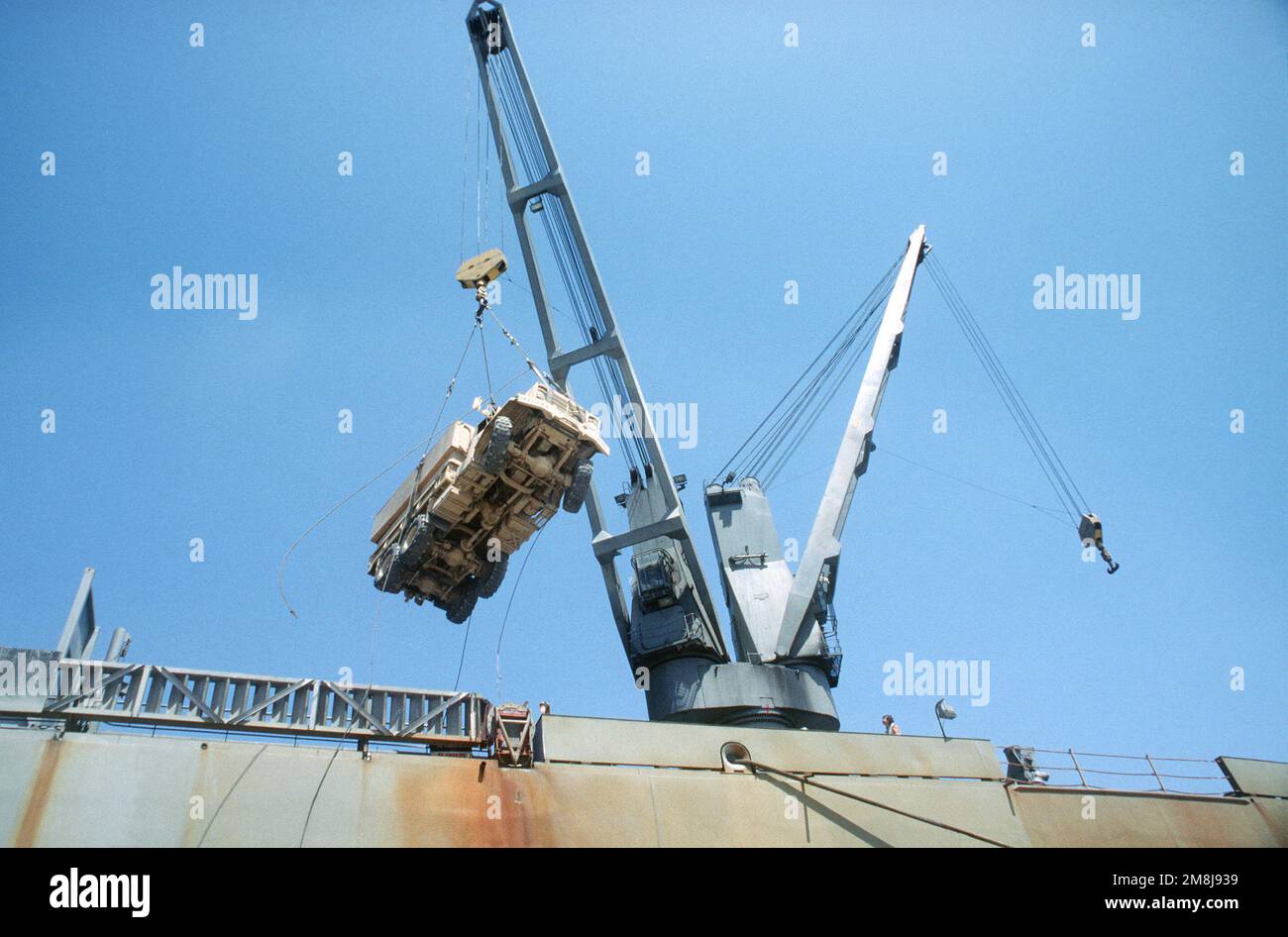 The 155th Transportation Company, Fort Eustis, VA, load an M9A9 5-ton ...