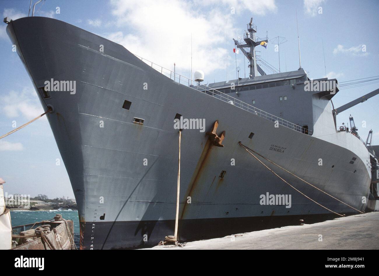 A port bow view of the USNS Denebola in the port of Mogadishu. Subject ...
