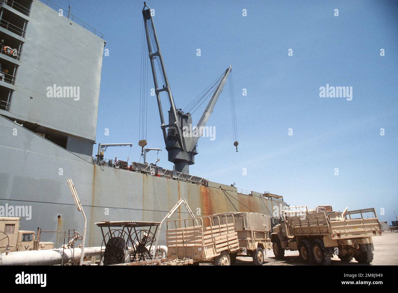 A view of the USNS Denebola and the vehicles and equipment to be upload ...