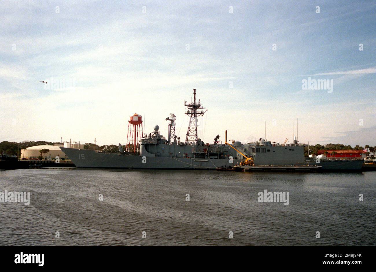 A port side view of the guided missile frigate USS ESTOCIN (FFG-15 ...