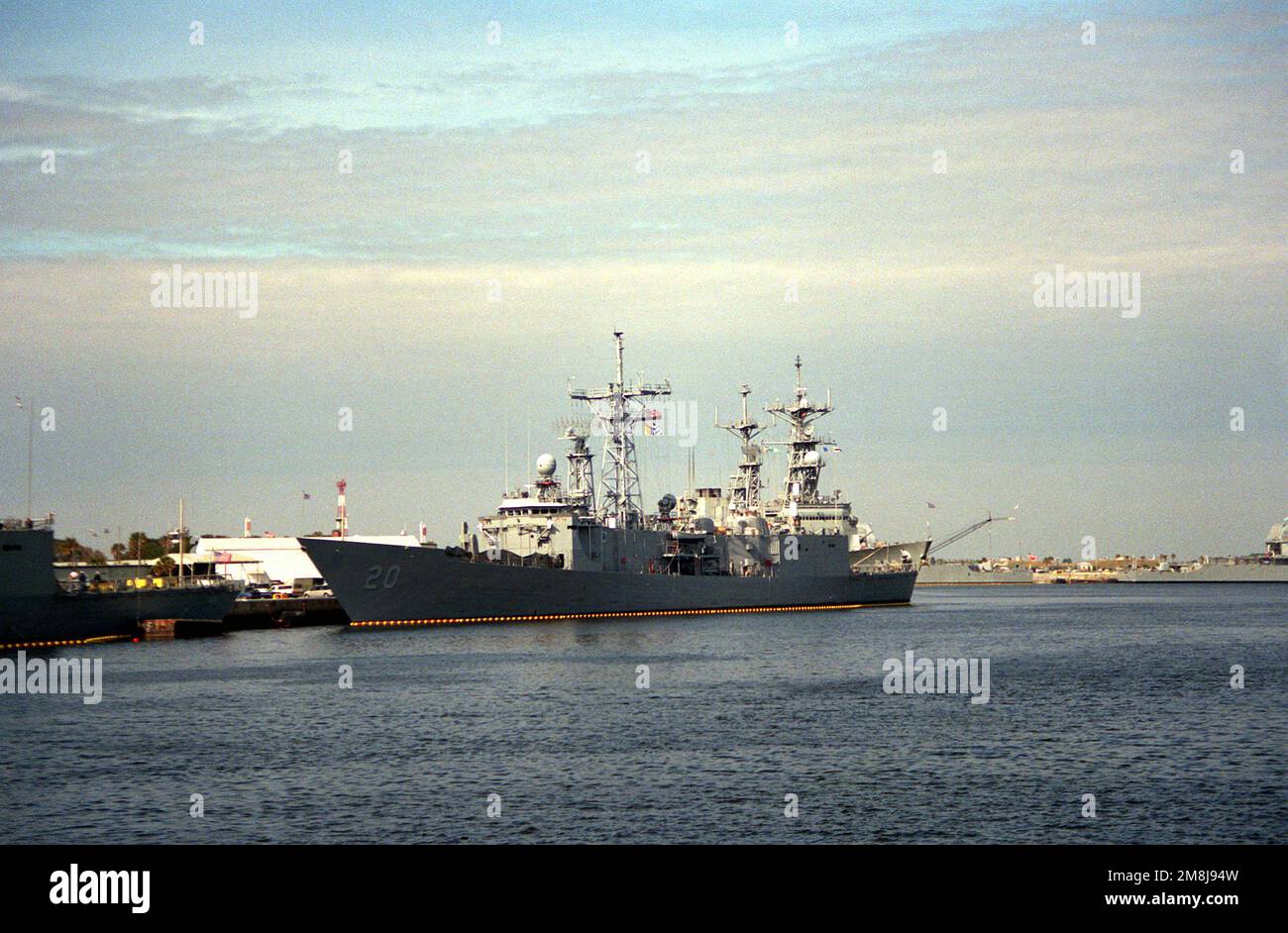 A port side view of the guided missile frigate USS ANTRIM (FFG-20) tied ...
