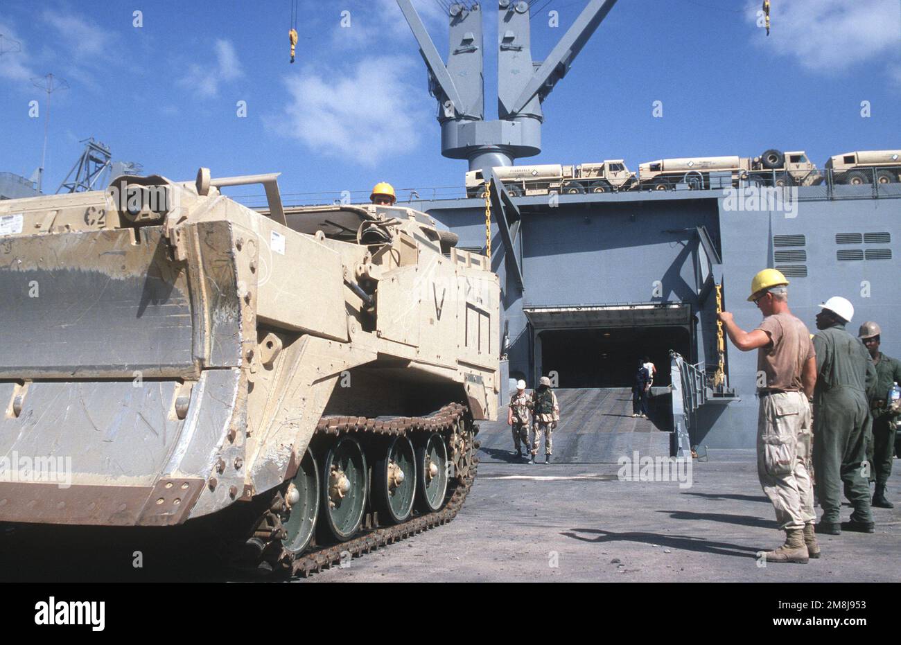 The 155th Transportation Company, Fort Eustis, VA, guides a bulldozer ...