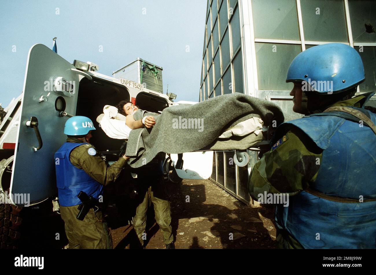 The first wounded patients arrive by armored personnel carrier (APC) at ...