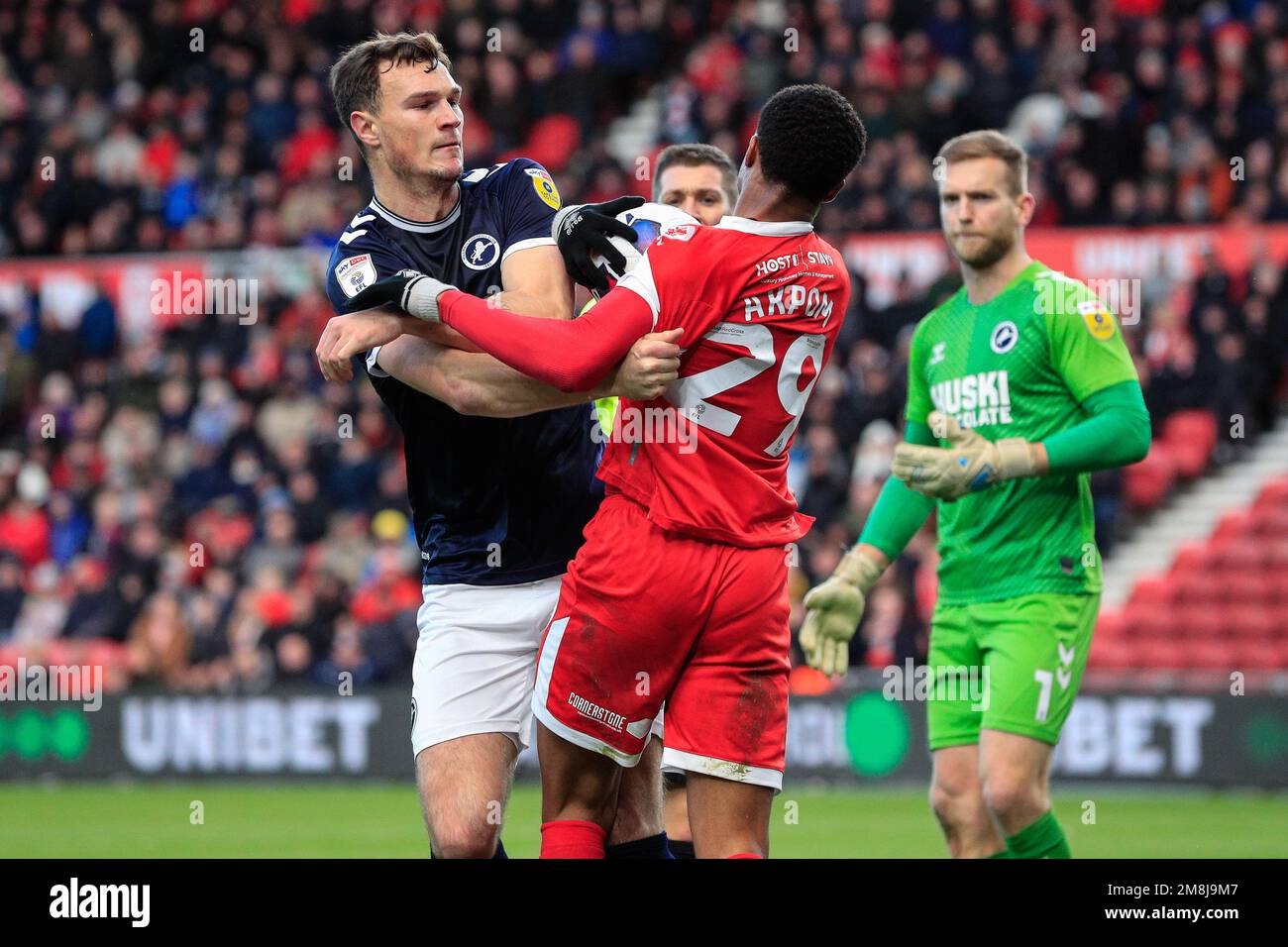 Jake Cooper #5 of Millwall and Chuba Akpom #29 of Middlesbrough come to ...
