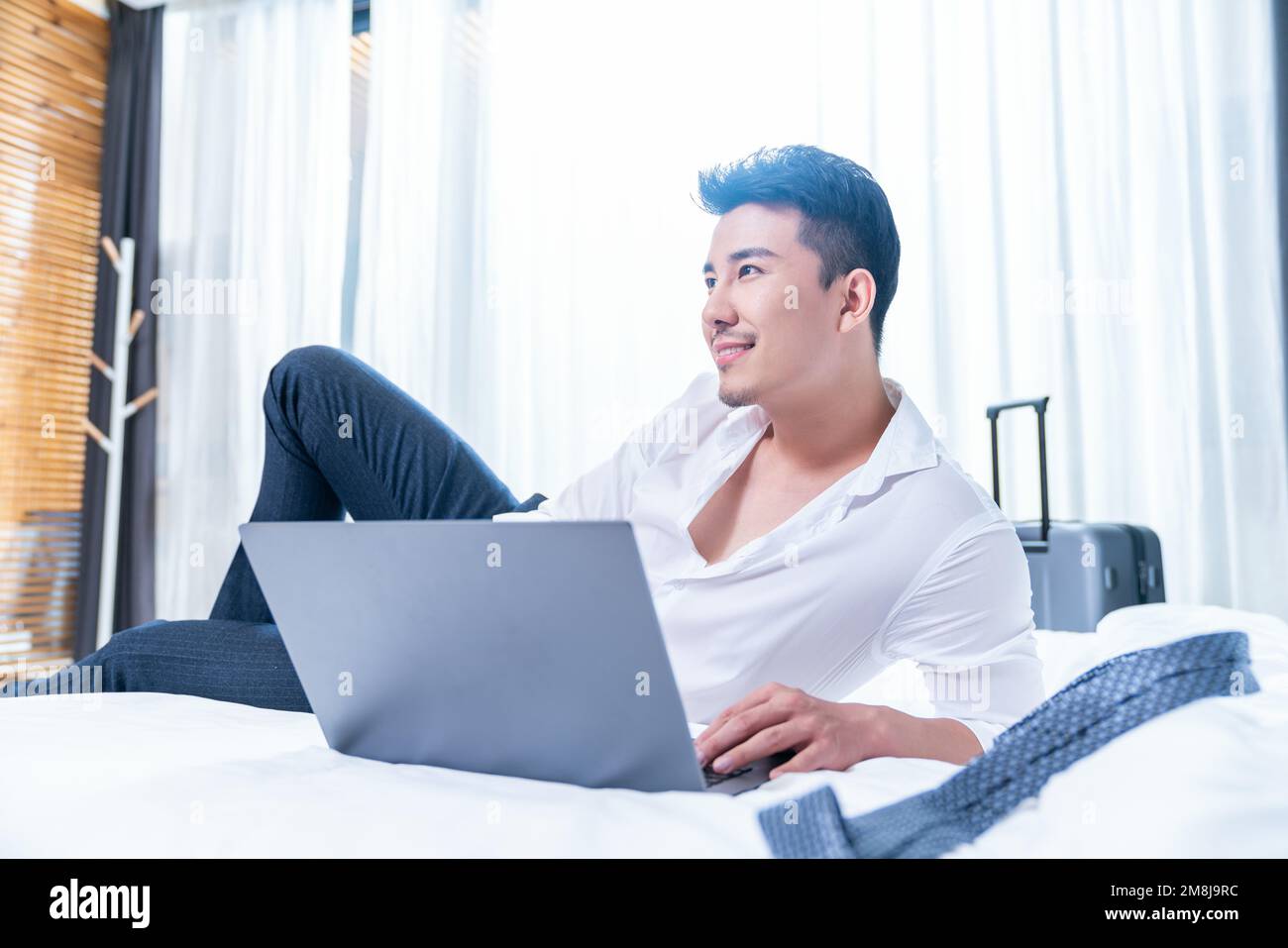 Business man in the hotel to use notebook PC Stock Photo - Alamy