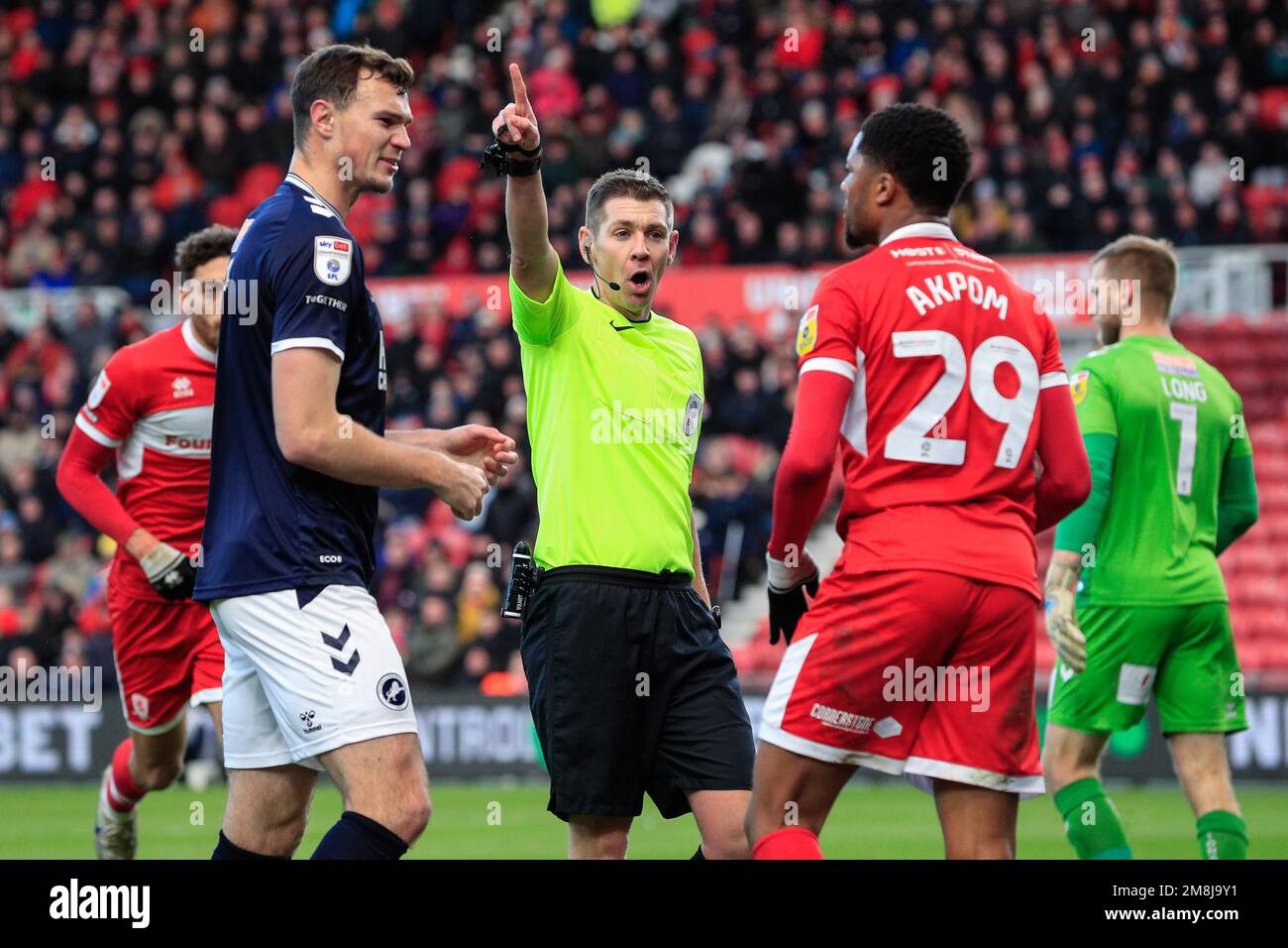 Referee Matthew Donohue breaks up the fight between Jake Cooper #5 of ...
