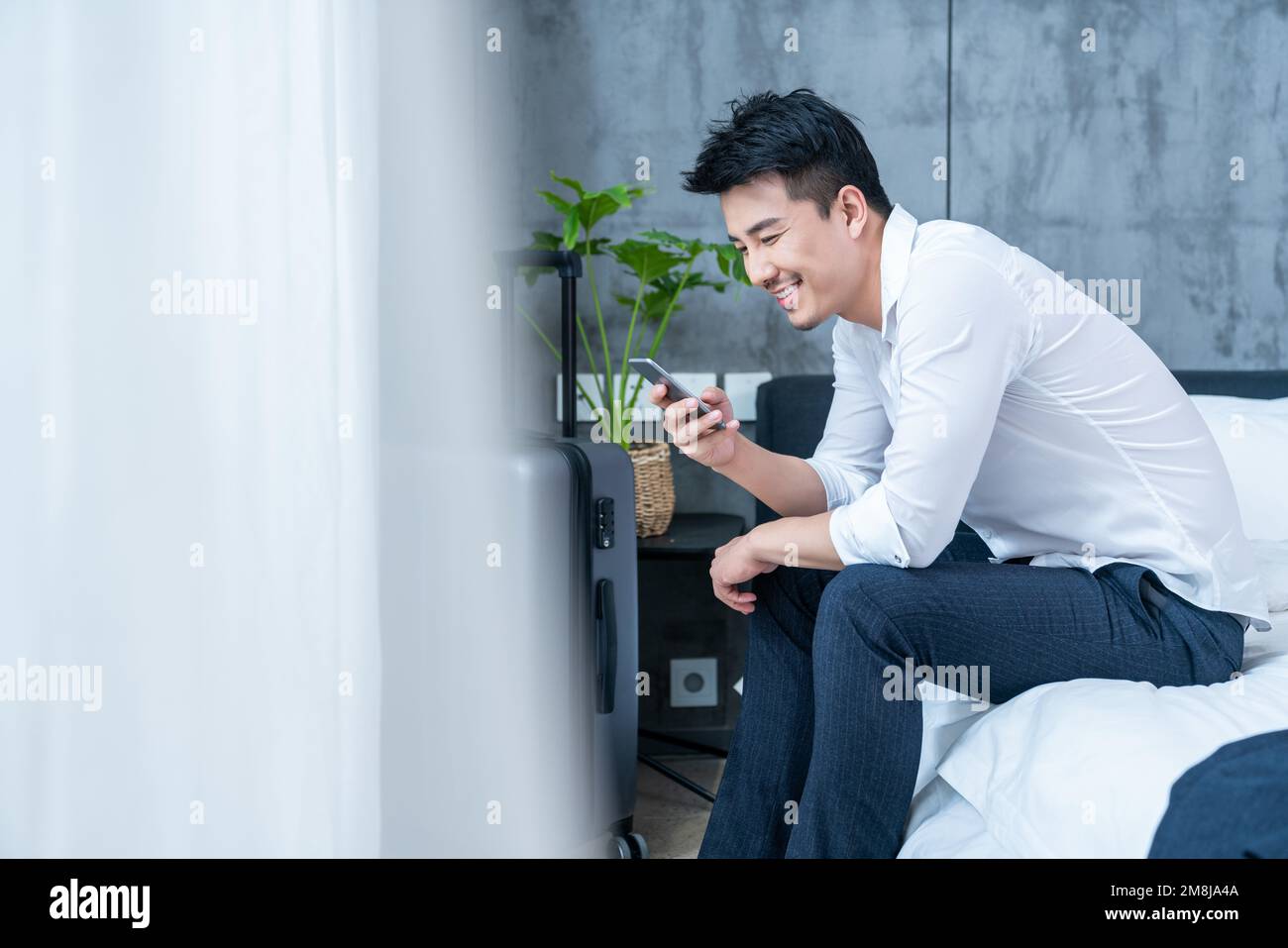 Business man in the hotel the use of mobile phones Stock Photo - Alamy