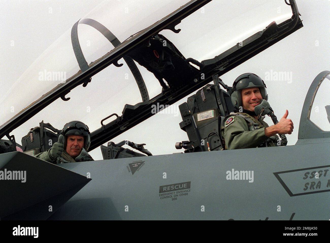 The thumbs up signal is given by LT. COL. Charlie Heald (front seat ...