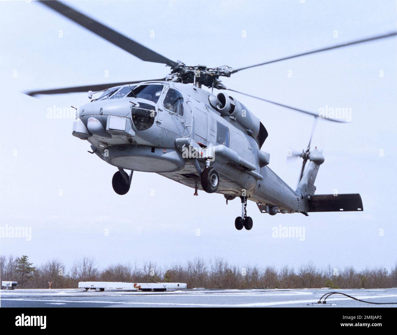 An SH-60B Seahawk helicopter completes a Recovery Assist, Secure ...
