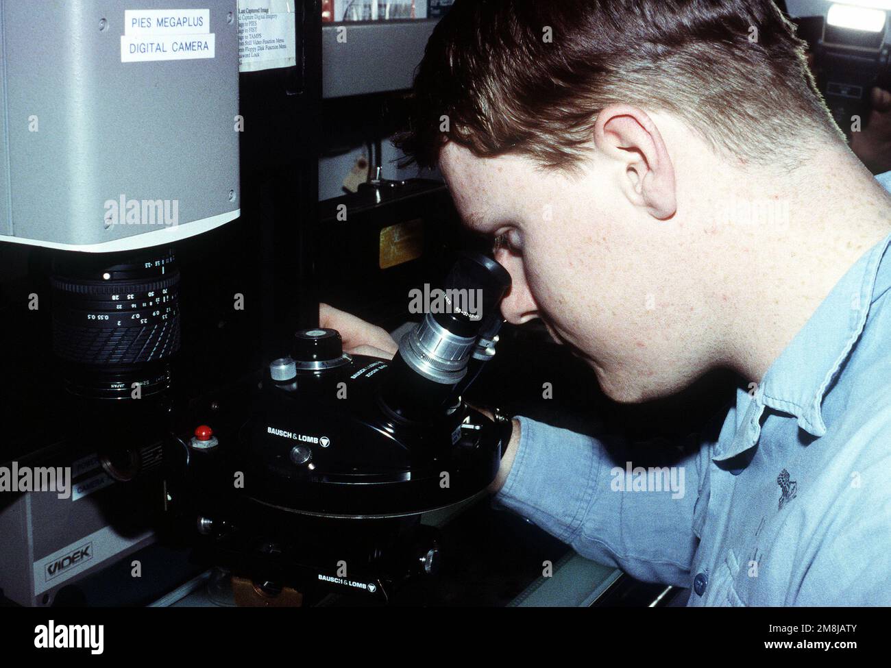 Intelligence SPECIALIST Second Class (IS2) Eric Rasch performs imagery ...