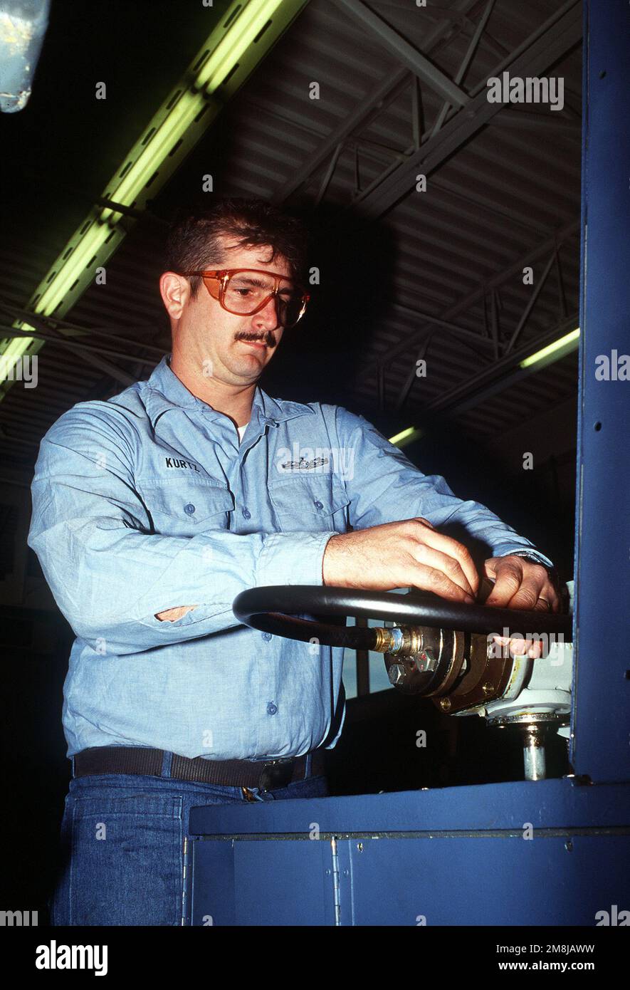 Boiler Technician First Class (BT1) Martin Kurtz tests and makes ...
