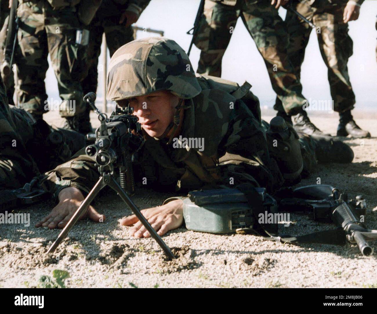 A Recruit from Marine Corps Recruit Depot, San Diego, fires a M249 ...