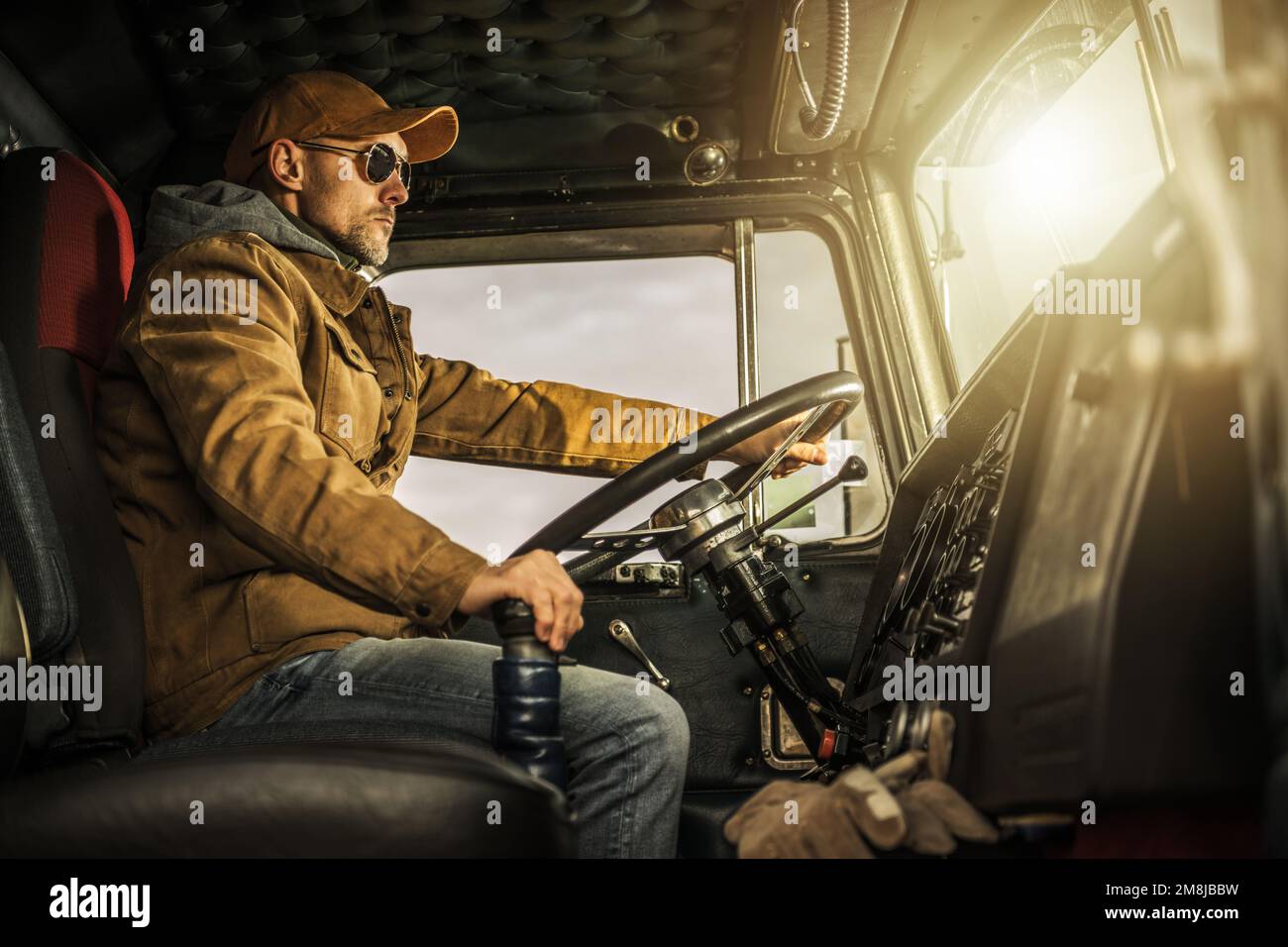 Professional Semi Truck Driver Behind the Wheel of a Classic Truck ...