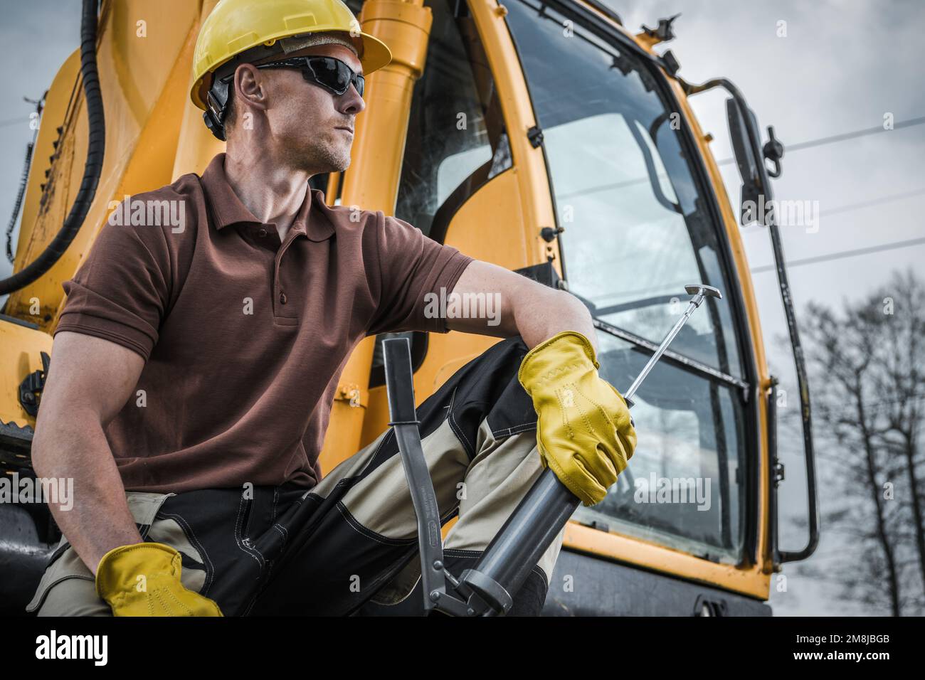 Caucasian Excavator Digger Operator in His 40s and His Machine ...