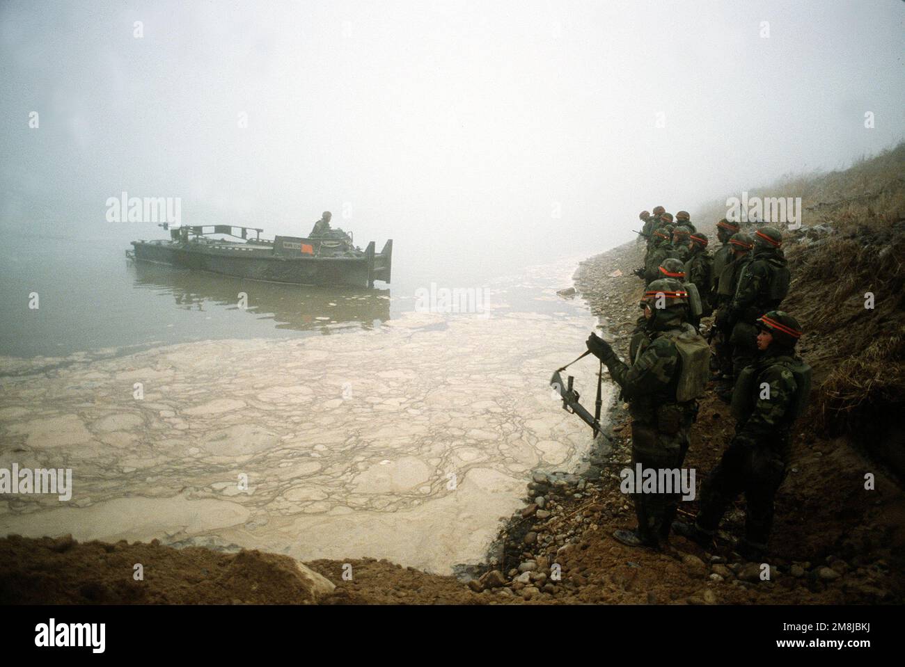 Soldiers from the 50th Engineers Assault Float Bridge Company wait for ...