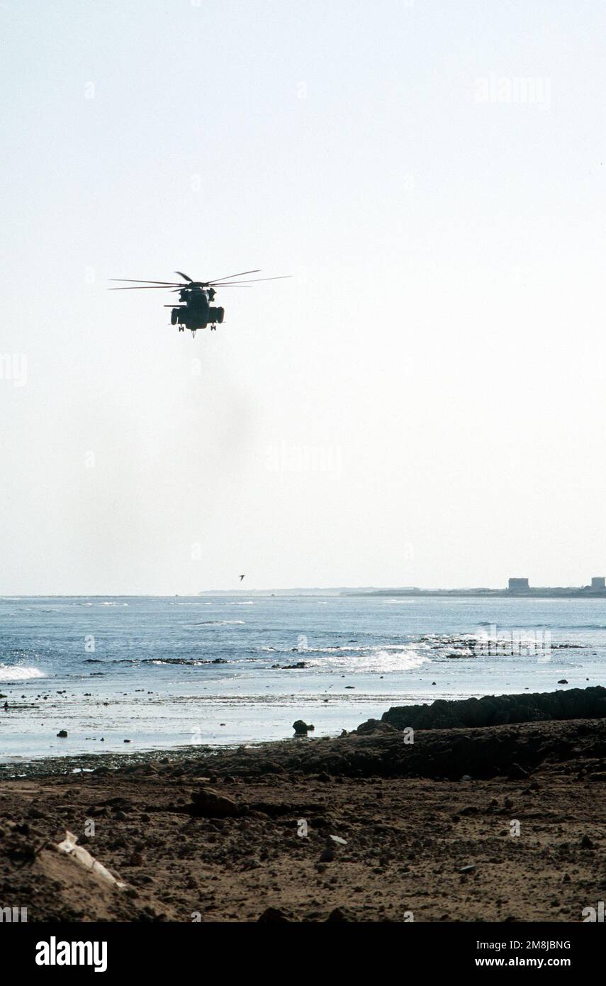 A CH-53E Super Stallion helicopter approaches Green Beach on its way to ...