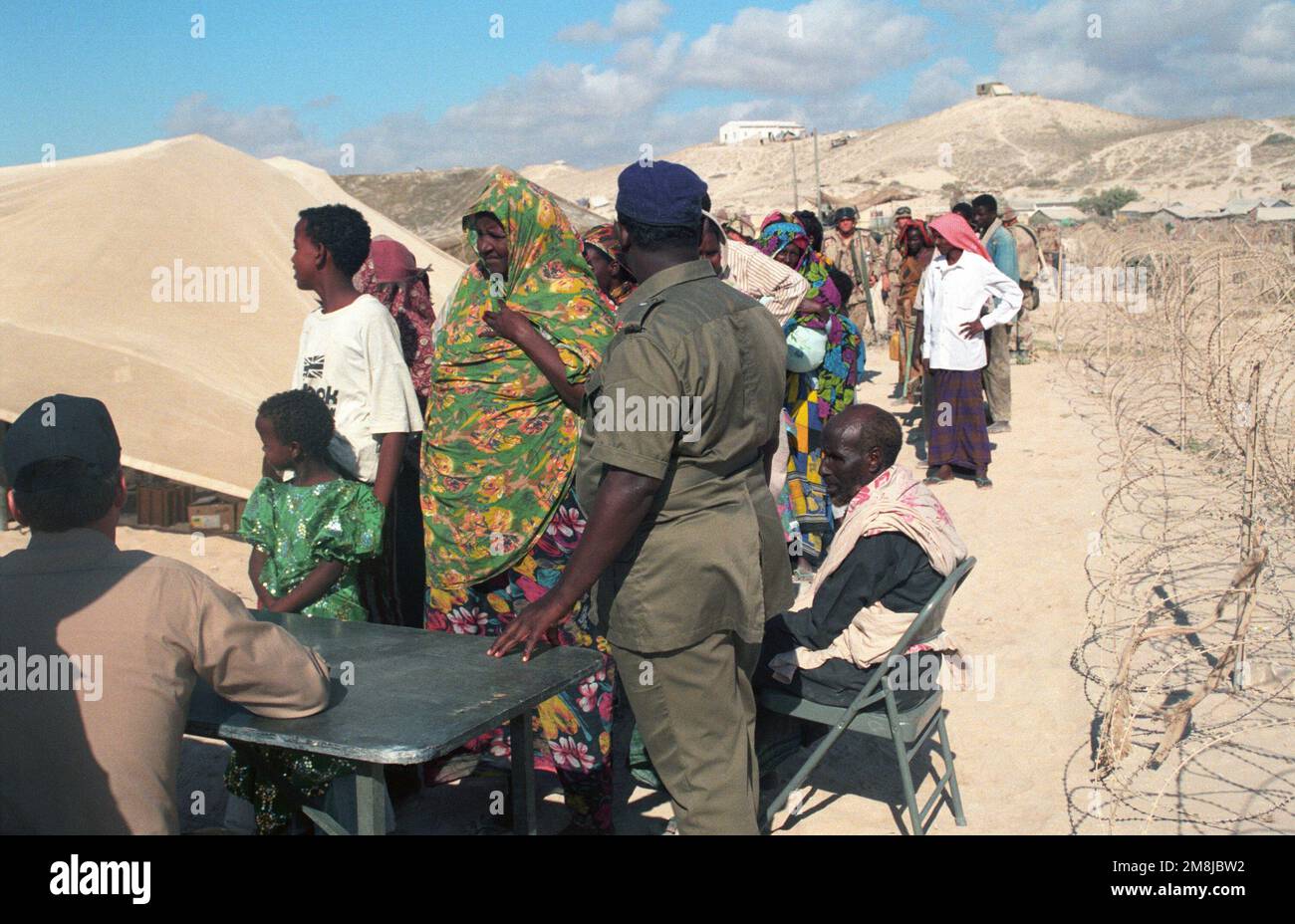 Somali citizens wait in a Medical Civilian Assistance Program (MEDCAP ...