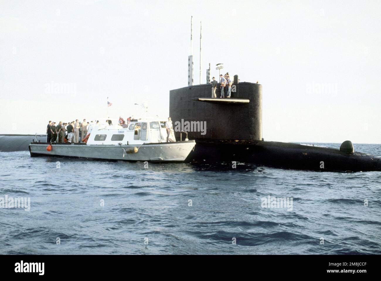 A Swift boat comes alongside the nucelar-powered attack submarine USS ...